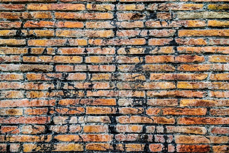 Old Brick Wall with Long Red Cracked Bricks and Black Tar Smudges ...