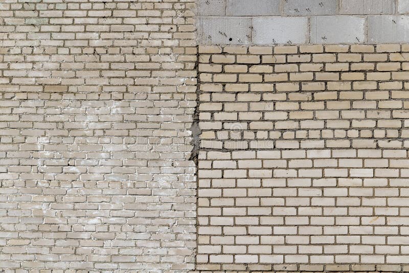 An Old Brick Wall Made of a Large Number of Different Types of Bricks ...