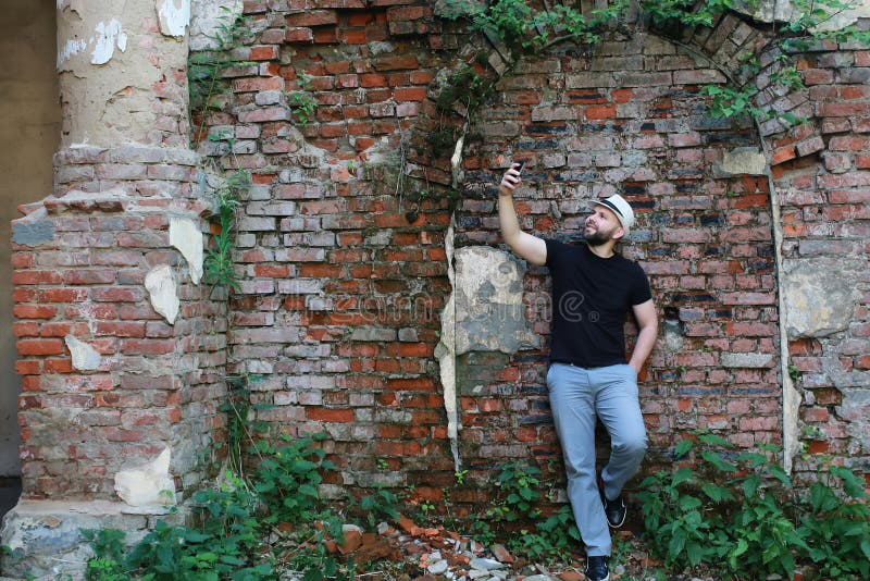 Old brick wall man stand stock image. Image of grunge - 89186361