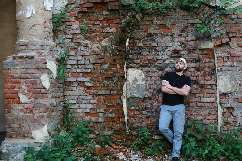 Old brick wall man stand stock image. Image of metal - 78798297