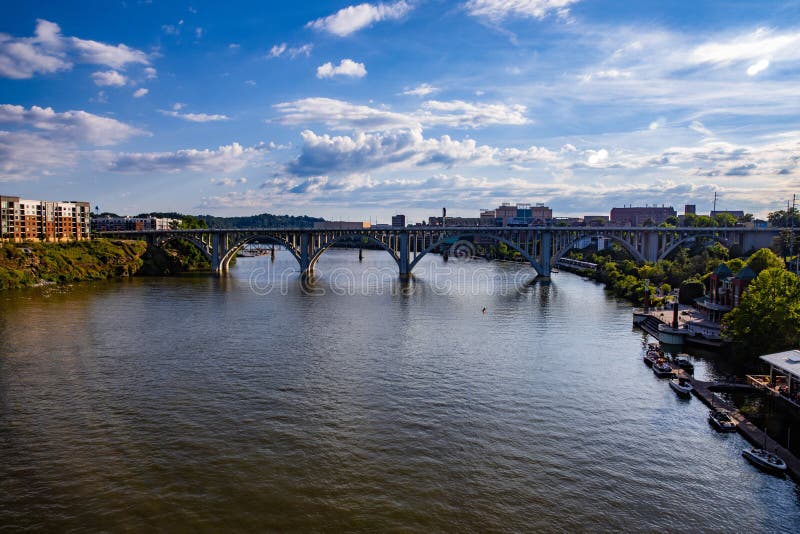 Old Bridge on a Big River Flowing through the City Stock Image - Image ...