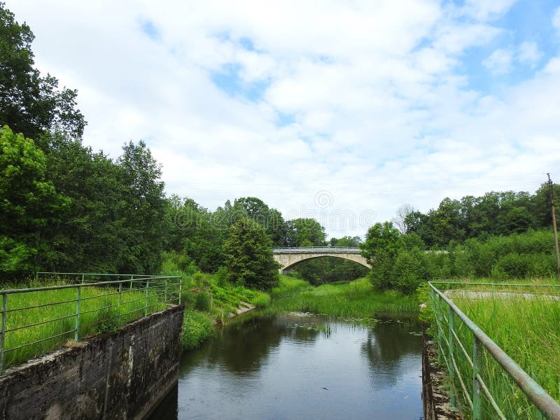 Damp, Bridge and Small Lake, Lithuania Stock Photo - Image of bush ...