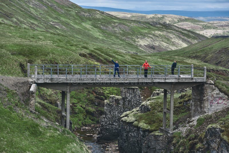 The Old Bridge Over the Gorge with a Stream in the Mountains Stock ...