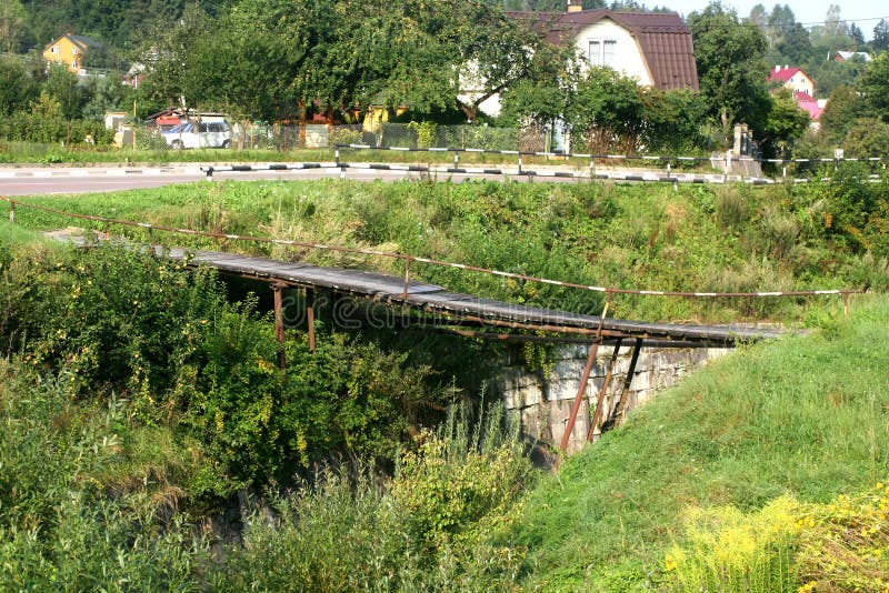Old Bridge Over the Ravine. Wooden Bridge Over the River. Stock Image ...
