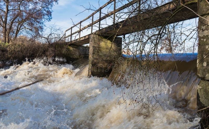 Old Bridge Over a Weir on a Small River Stock Photo - Image of flowing ...
