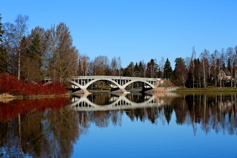 An Old Bridge Reflecting on Water Stock Photo - Image of bridge ...