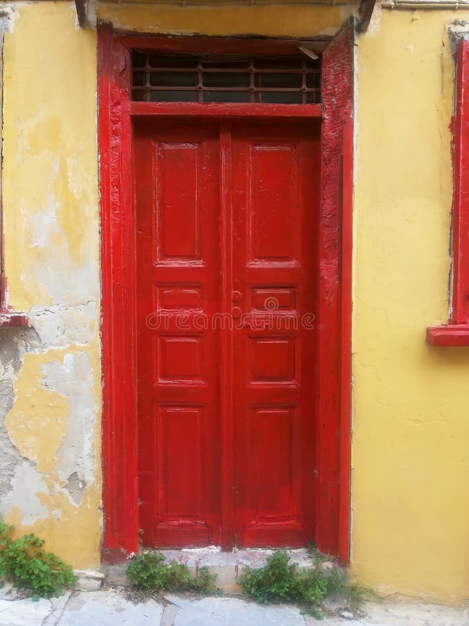 An Old Bright Red Door in a Yellow Wall Stock Photo - Image of historic, yellow: 362017356