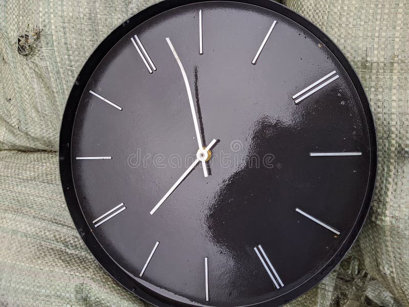 Old and Broken Black Clock in a Garbage Dump in a Rainy Time. Stock ...