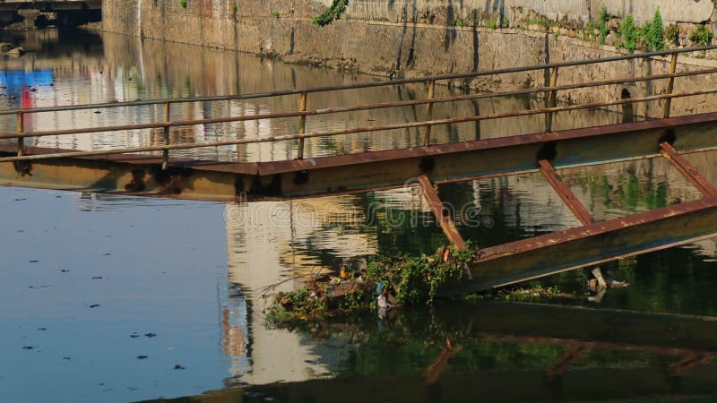 The Old and Broken Bridge Over the River in the Morning Stock Photo ...
