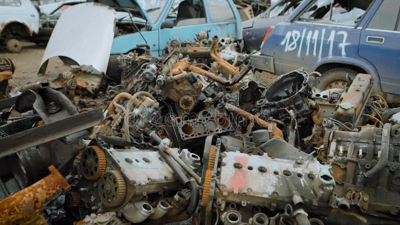 Old Broken Car Engines are Lying in Big Stack on a Ground in an Area of ...