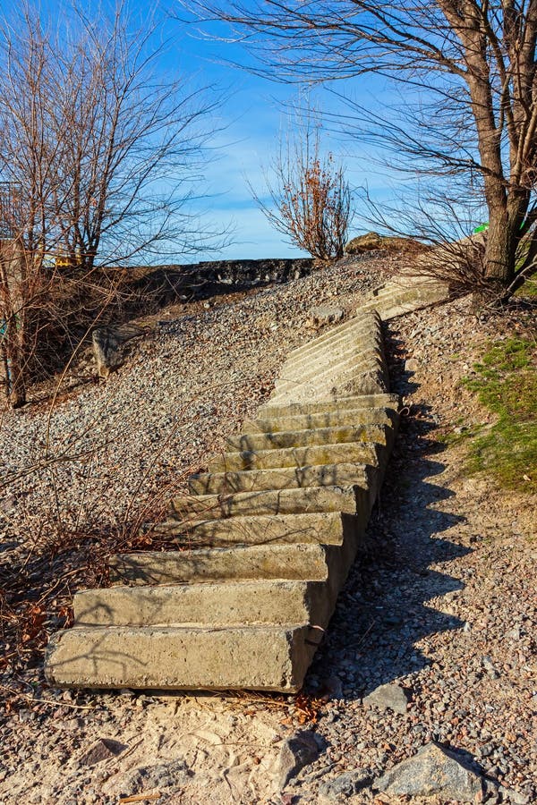 Old Broken Concrete Stairs on Rocky Slope with Trees without Leaves ...