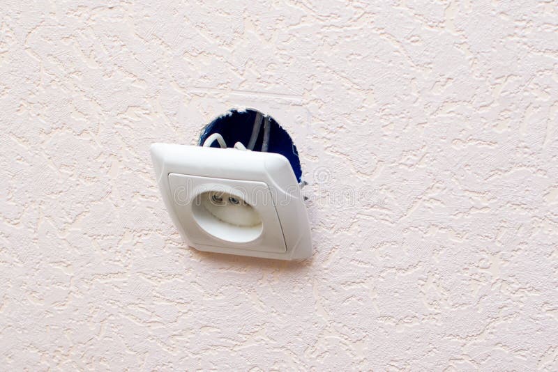 An Old Broken Electrical Outlet Fell Out of the Wall, Danger of ...
