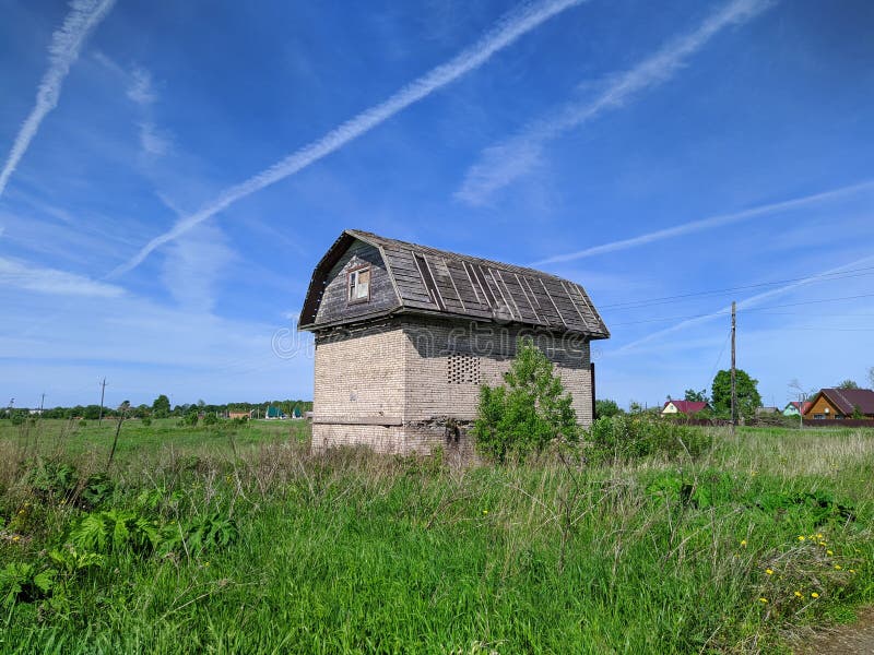 Old and Broken House Made of White Bricks on a Blue Sky Background ...