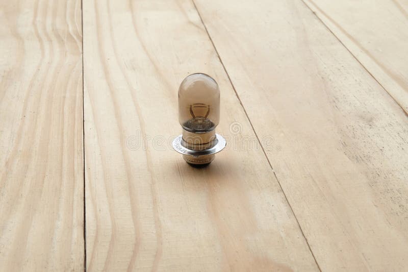 Old or Broken Light Bulb on Wood Stock Image - Image of burned, white ...