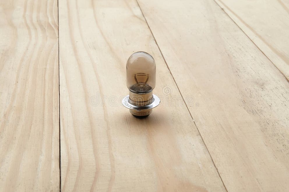 Old or Broken Light Bulb on Wood Stock Image - Image of burned, white ...