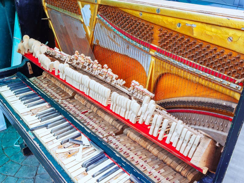 An Old Broken Piano with a Missing Wall and Cover and Broken Keys Stock ...