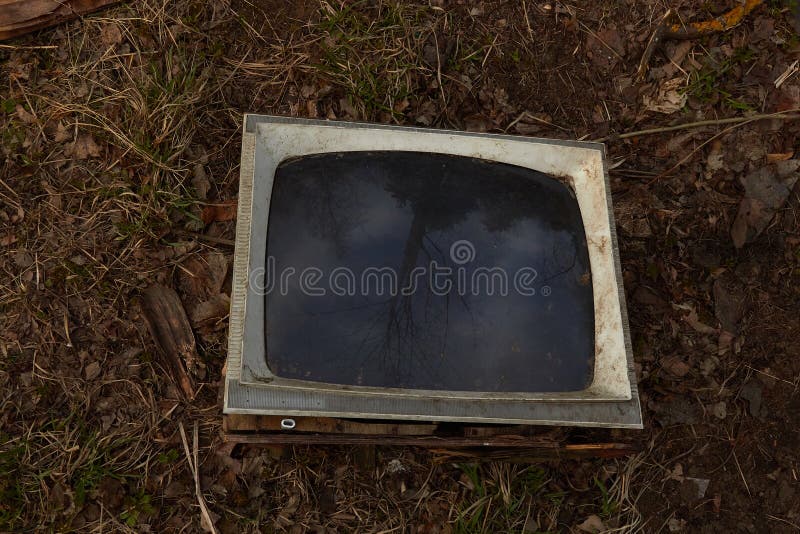 Old Broken TV on the Ground with a Black Screen Stock Photo - Image of ...