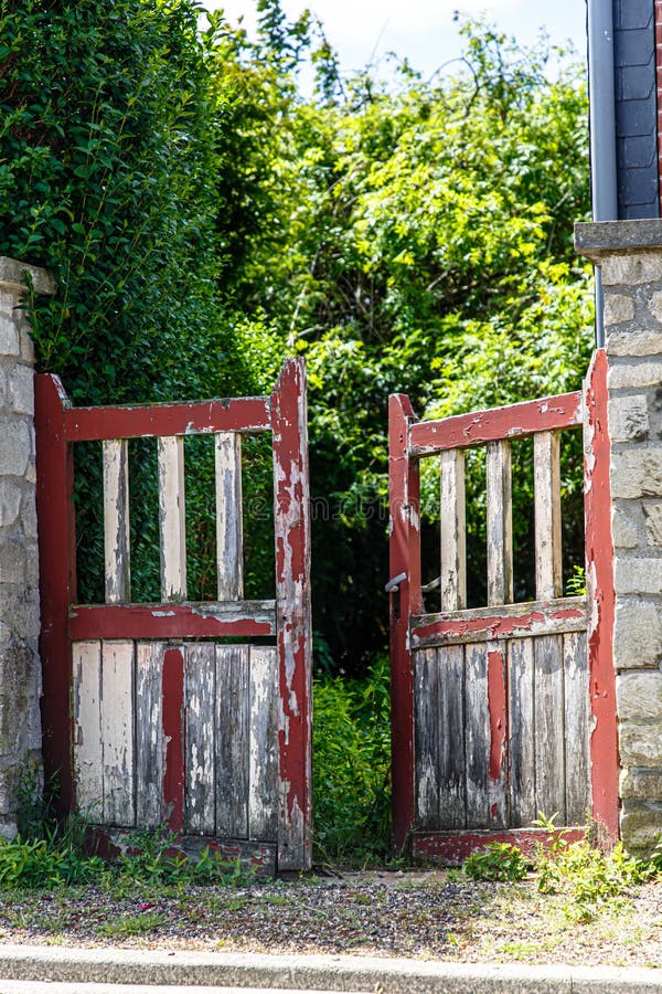 A Broken Gate and an Old Fence Overgrown with Grass Stock Image - Image ...