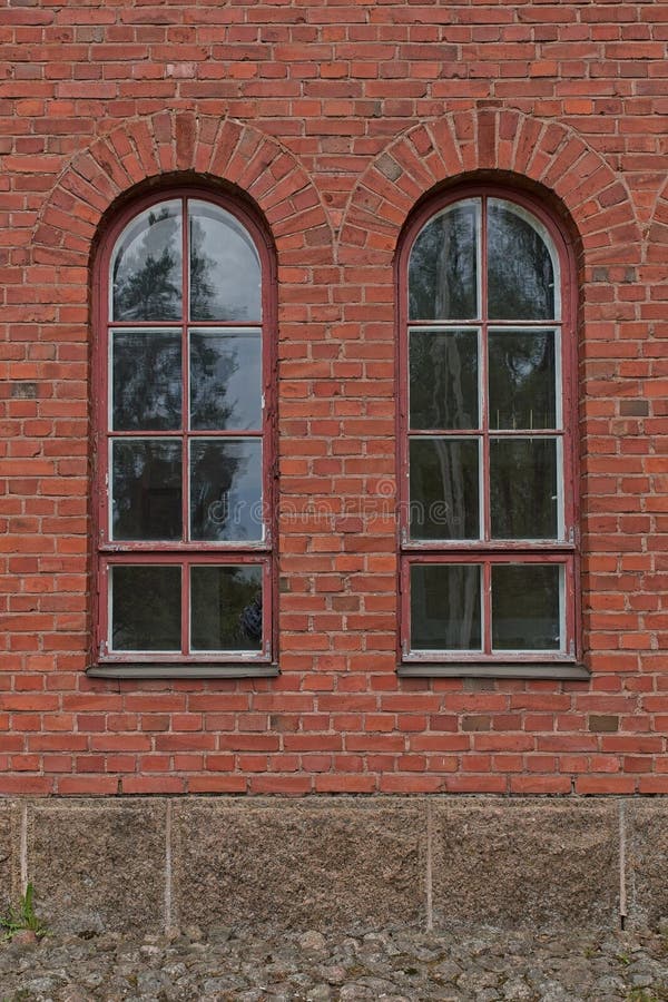 Windows on red brick wall. stock image. Image of brick - 372133389