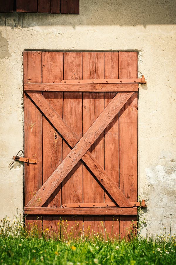 Old Brown Wooden Door from a Concrete Barn Stock Photo - Image of lock ...