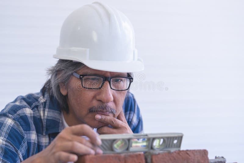 Old Builder Craftsman Leveling Brick Wall Stock Photo - Image of ...