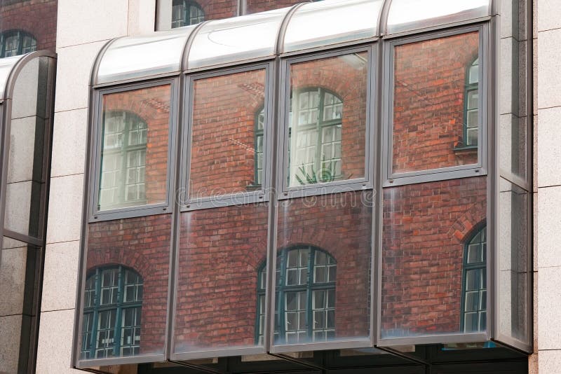 Old Building Architecture Reflected in Modern Building Stock Photo ...