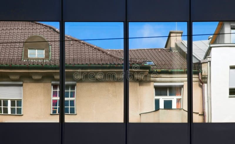 Old Building Architecture Reflected in Modern Building Stock Image ...