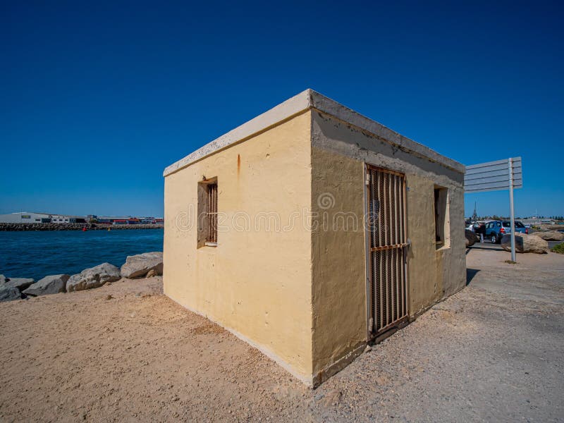 Old building in beach stock photo. Image of water, rocks - 258029370
