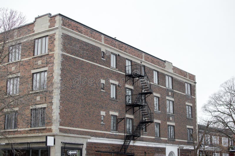Old Building with Fire Escape and Windows Stock Photo - Image of wall ...