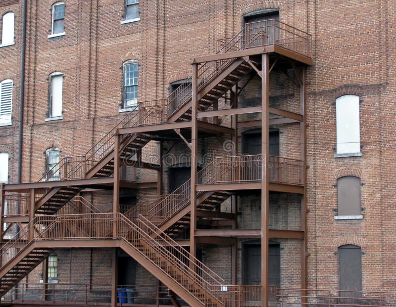 Old Building with Fire Escape Stairs Stock Photo - Image of windows ...