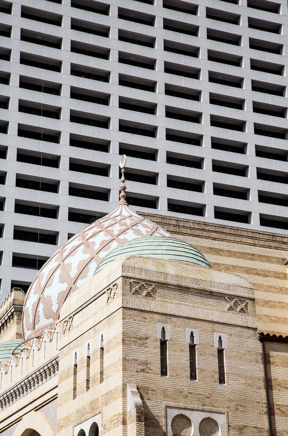 Old Building by New Tower, An old masonic building in front of a modern ...