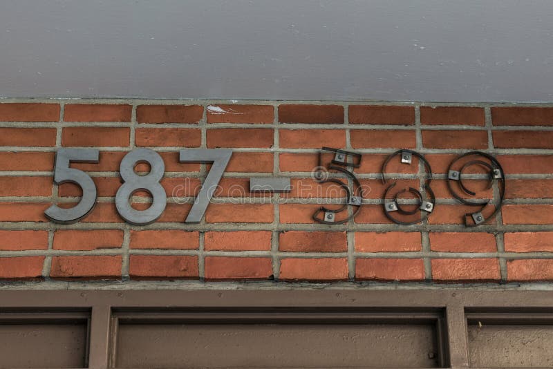 Old Building Number on a Brick Wall, with Some of the Numbers Missing ...