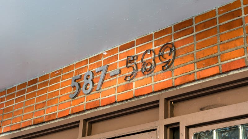 Old Building Number on a Brick Wall, with Some of the Numbers Missing ...