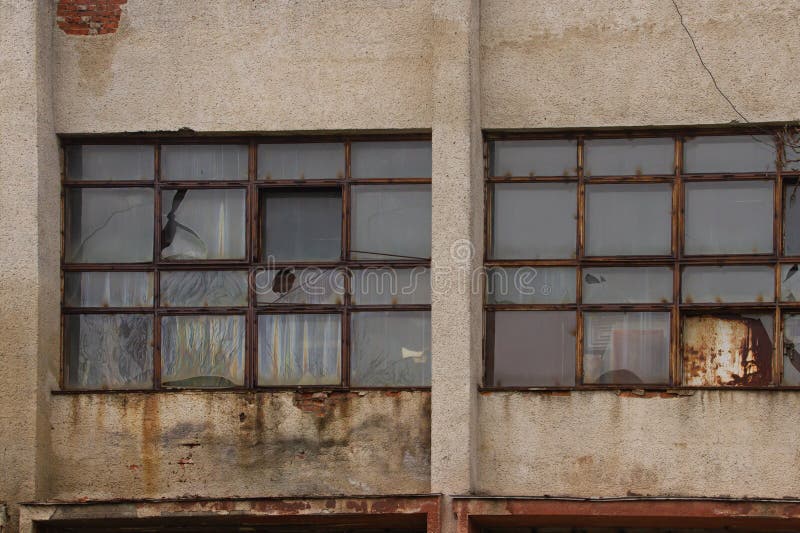 An Old, Abandoned Building with Rust and Broken Windows. Stock Photo ...