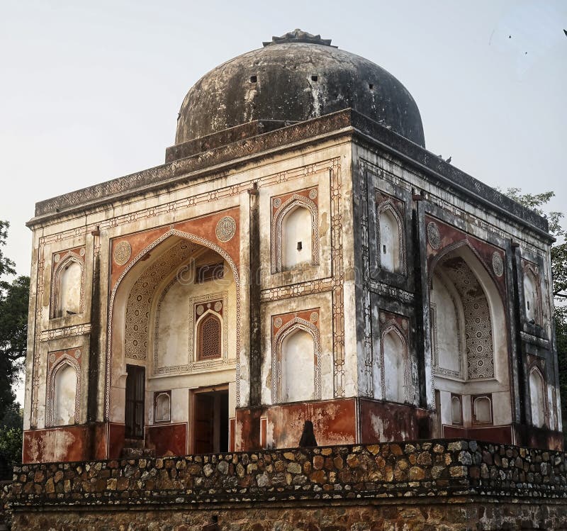 An Old Building with Two Arches and Two Windows on it Stock Image ...