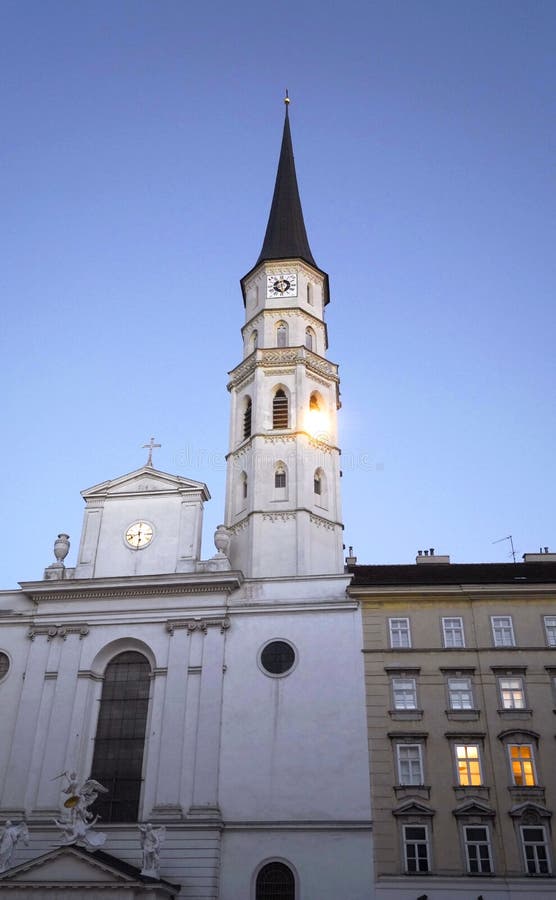 An Old Building with a White Tower and Clock in the Center of Vienna ...