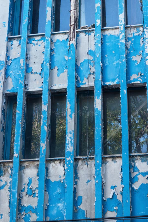 An Old Building with Windows with Peeling Paint and Plaster Stock Image ...