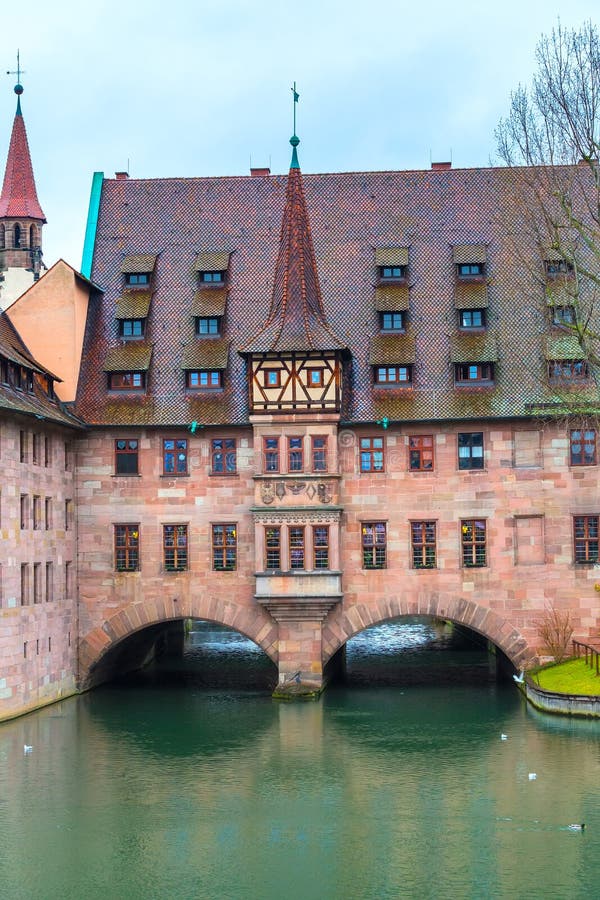 Old Buildings and Arch Bridge Reflected in Water. Nuremberg, Bavaria ...
