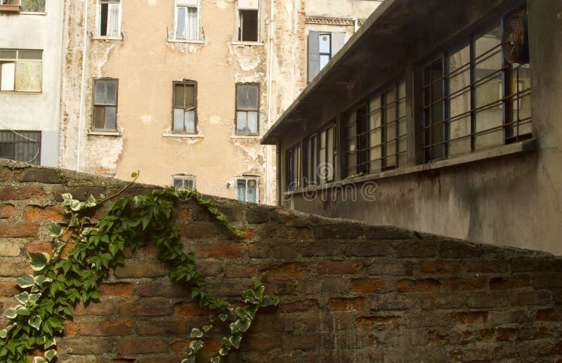 Old Buildings with Narrow Windows and Old Brick Wall Stock Image ...