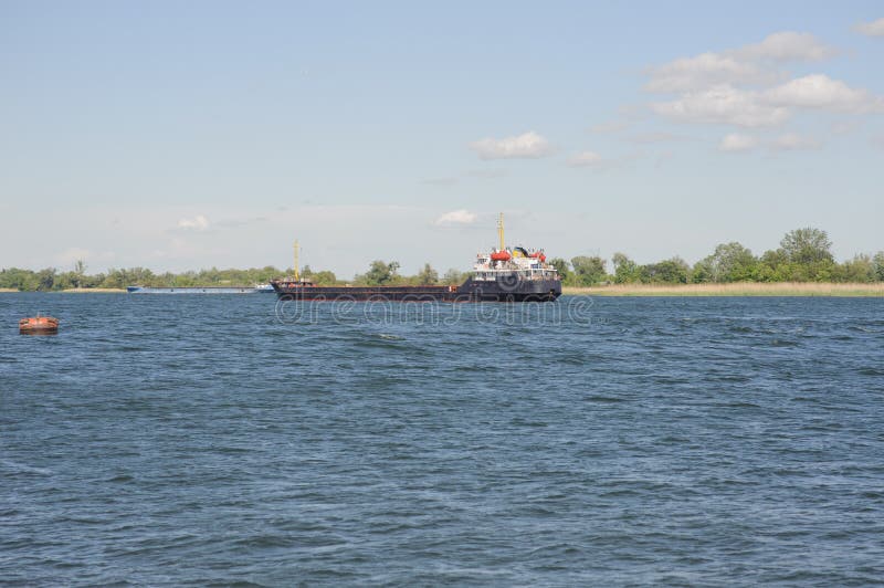 Old bulk carrier on river stock photo. Image of industrial - 89339490