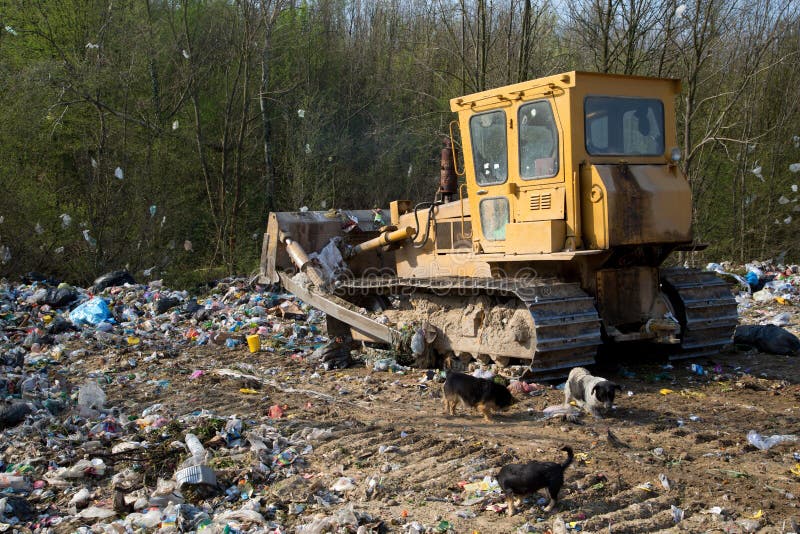 The Bulldozer on a Garbage Dump Stock Photo - Image of discard, disposa ...