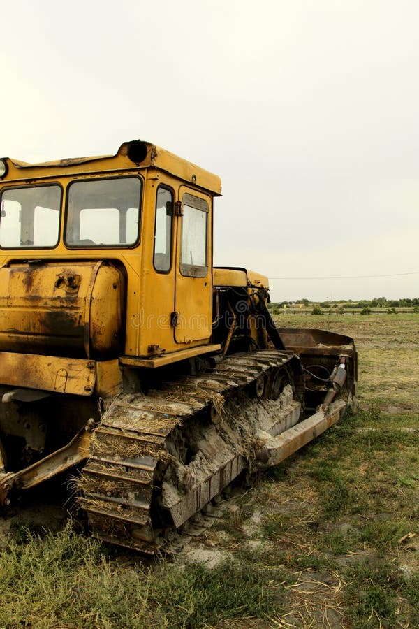 View of the Bulldozer from the Side Stock Photo - Image of grass, field ...