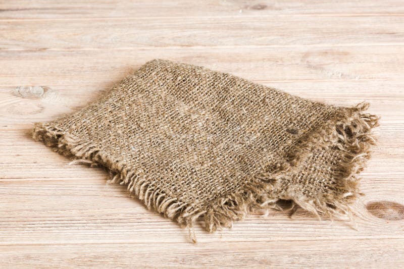 Old Burlap Fabric Napkin, Sackcloth on Table Background. Top View with ...