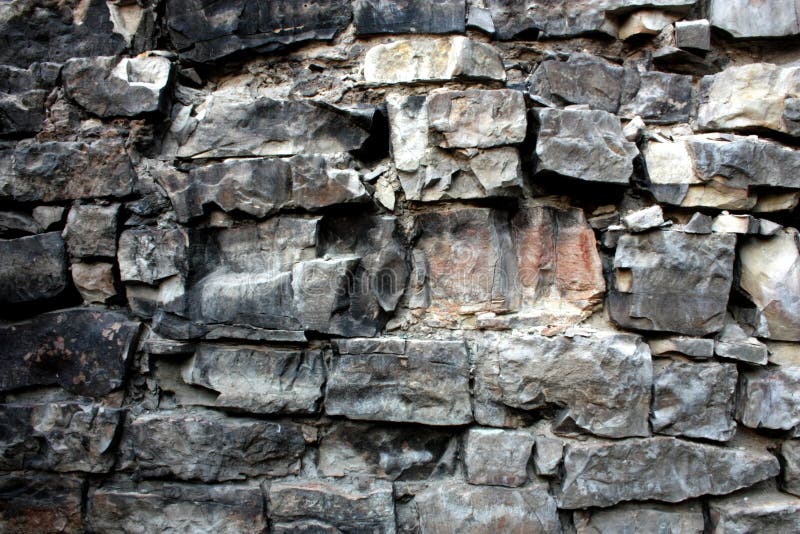An Old Burnt-out Wall Made of Limestone Blocks Stock Photo - Image of ...