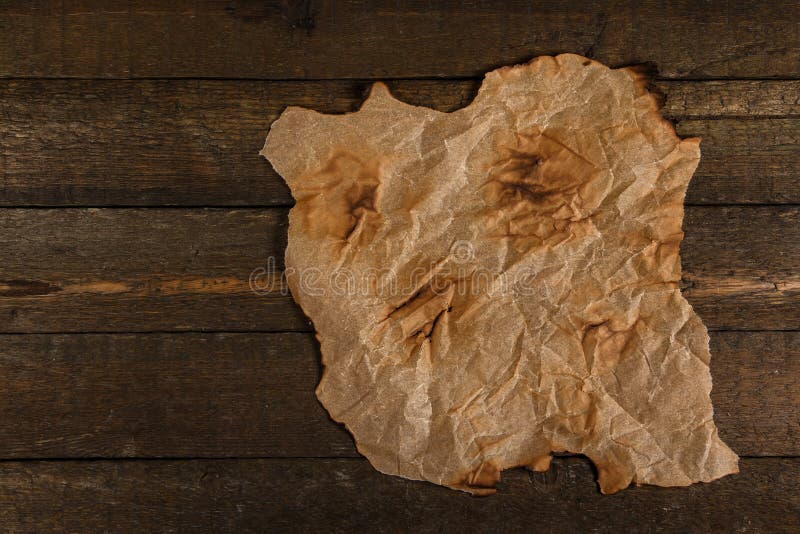 Old Yellow Burnt Piece Of Paper Stock Image - Image of table, write ...