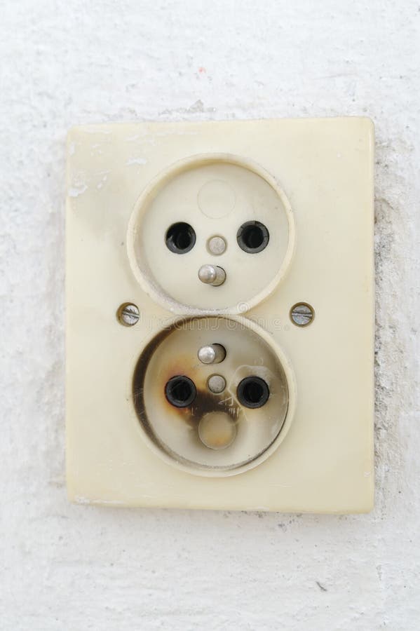 Old burnt plug in a wall stock photo. Image of voltage - 51516238
