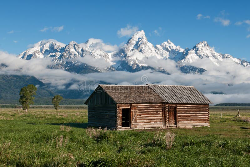 Old Cabin Under Mountains stock photo. Image of landscape - 25828706