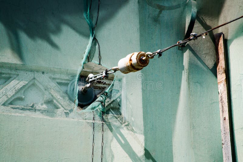 Old Cable Fixing To the Building and Protective Mesh Stock Image ...