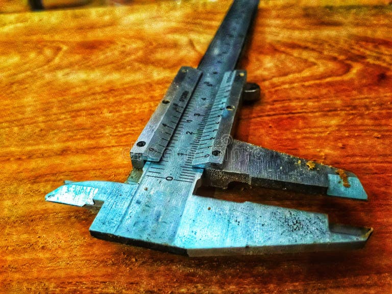 Old calipers on the table stock photo. Image of woodworking - 227827496