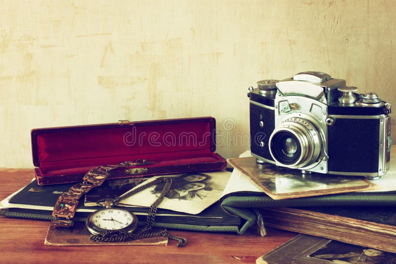 Old Camera, Antique Photographs and Old Pocket Clock Stock Photo ...